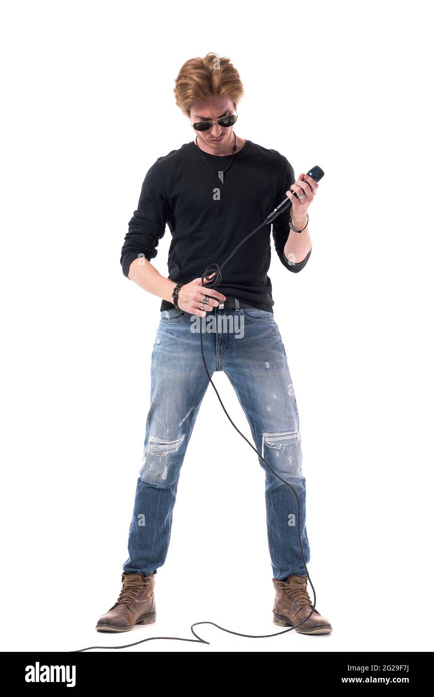 Young male rock music singer getting ready prepare and looking at ...