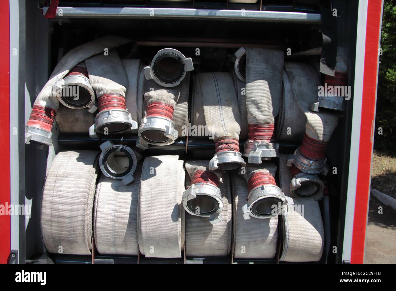 fire security concept - booster hoses in a fire engine close up Stock ...