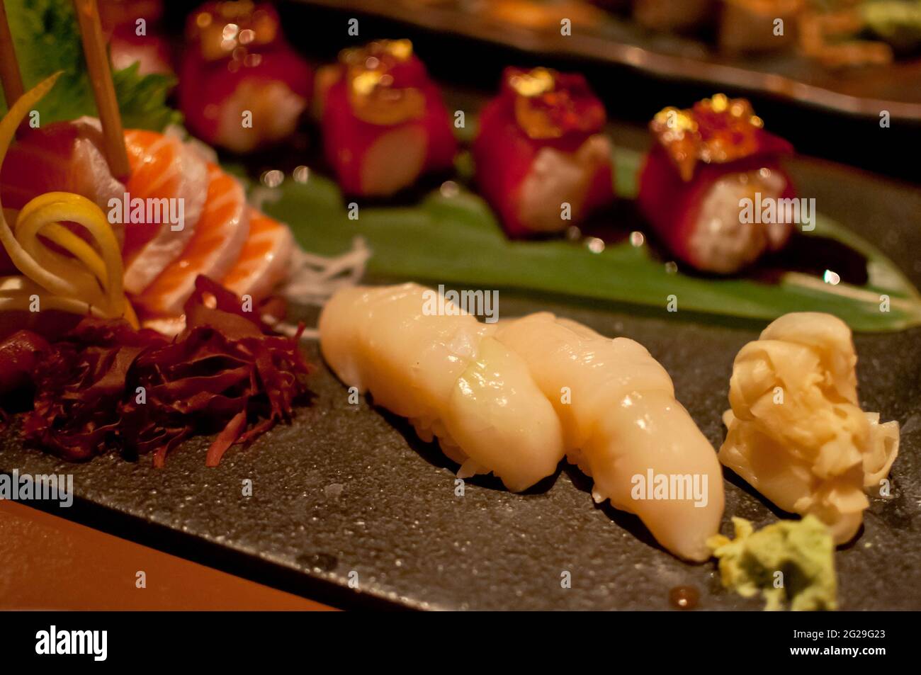 Sushi roll and sashimi platter Stock Photo - Alamy