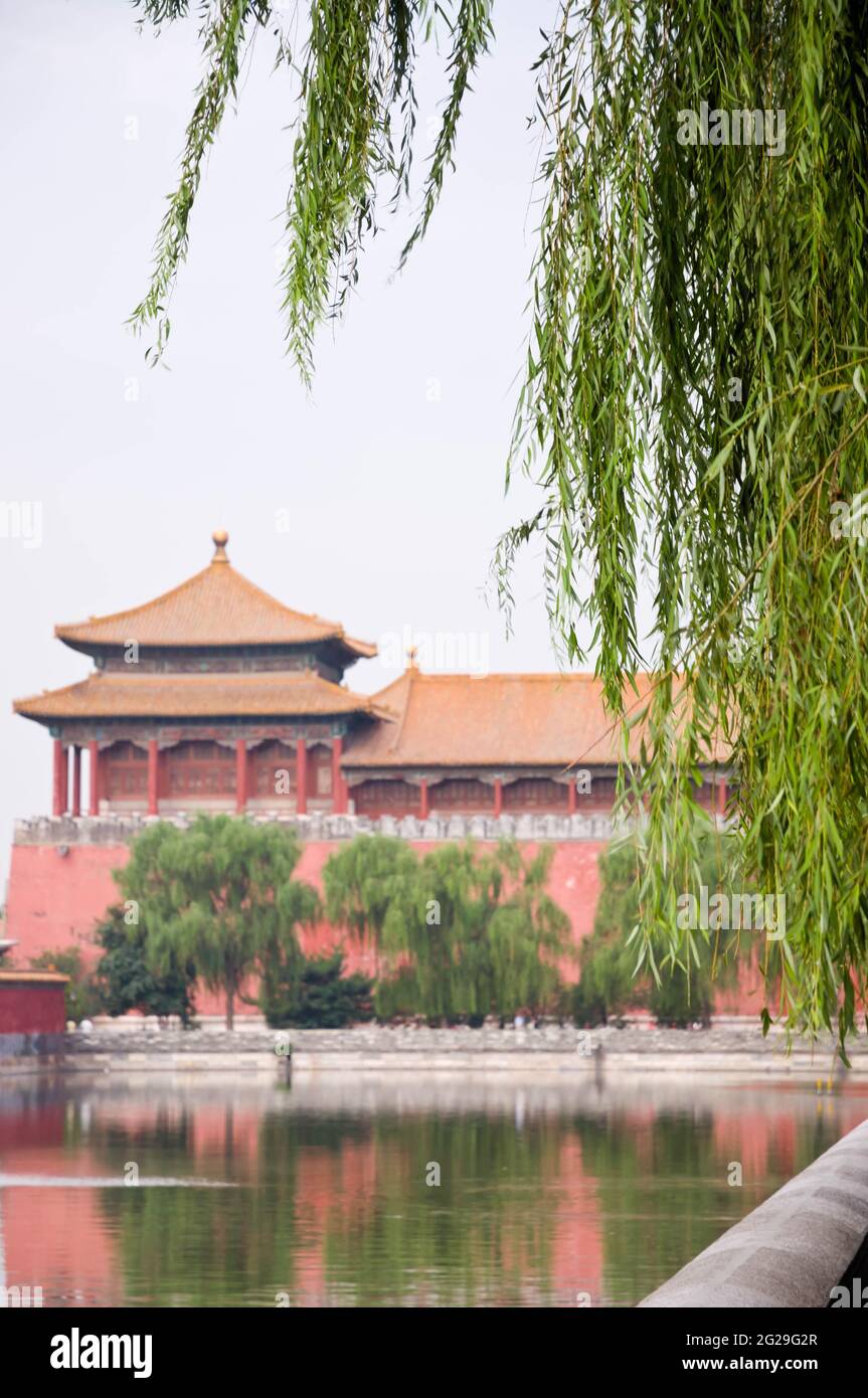Willow tree framing the tower of the Imperial Palace in Beijing, China ...