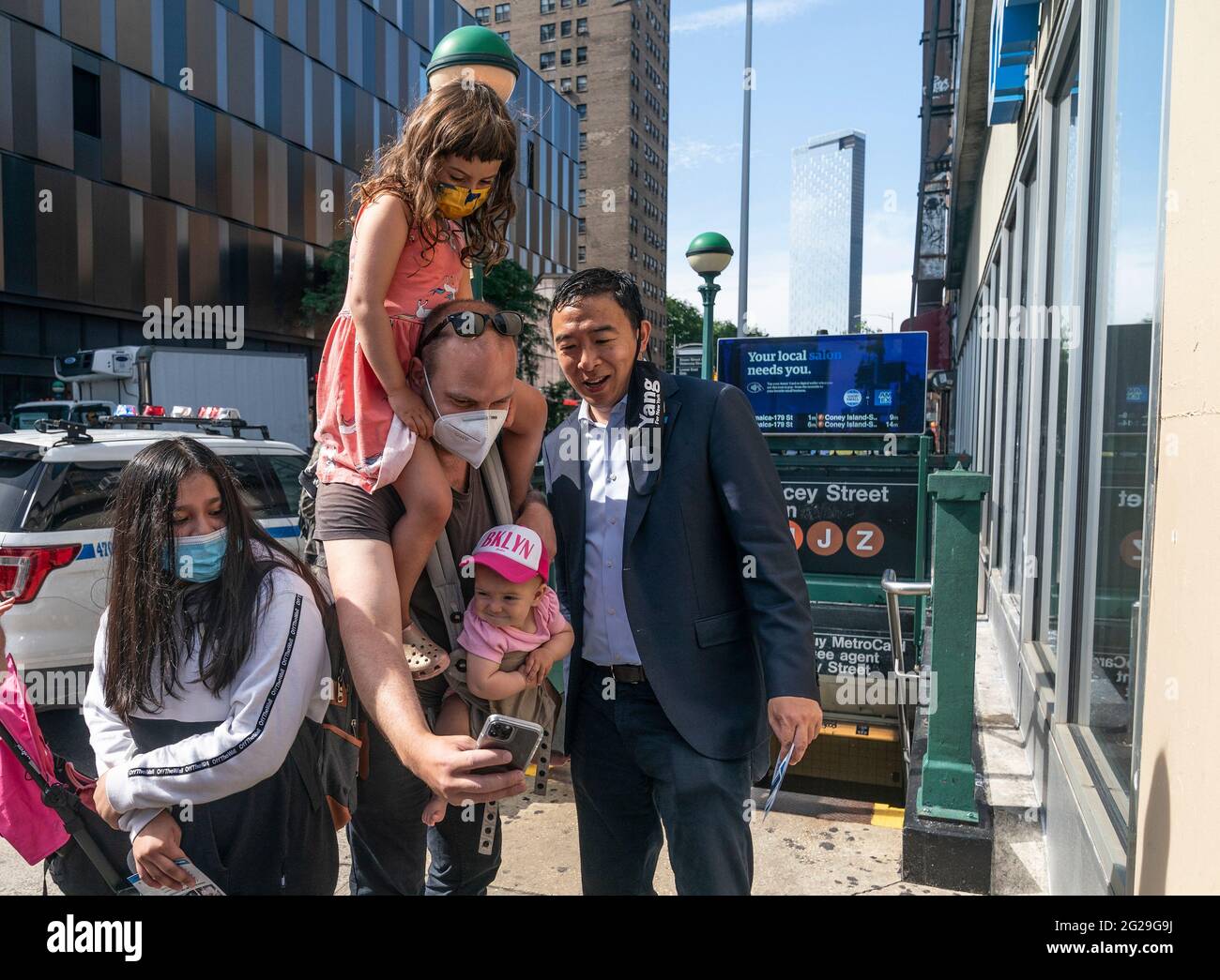 Mayoral candidate Andrew Yang with his wife Evelyn and team meet voters ...