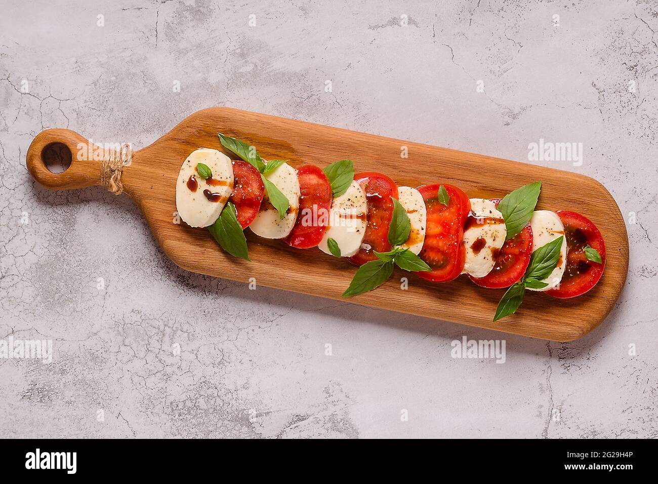 Italian caprese salad with sliced tomatoes, mozzarella, basil, olive ...