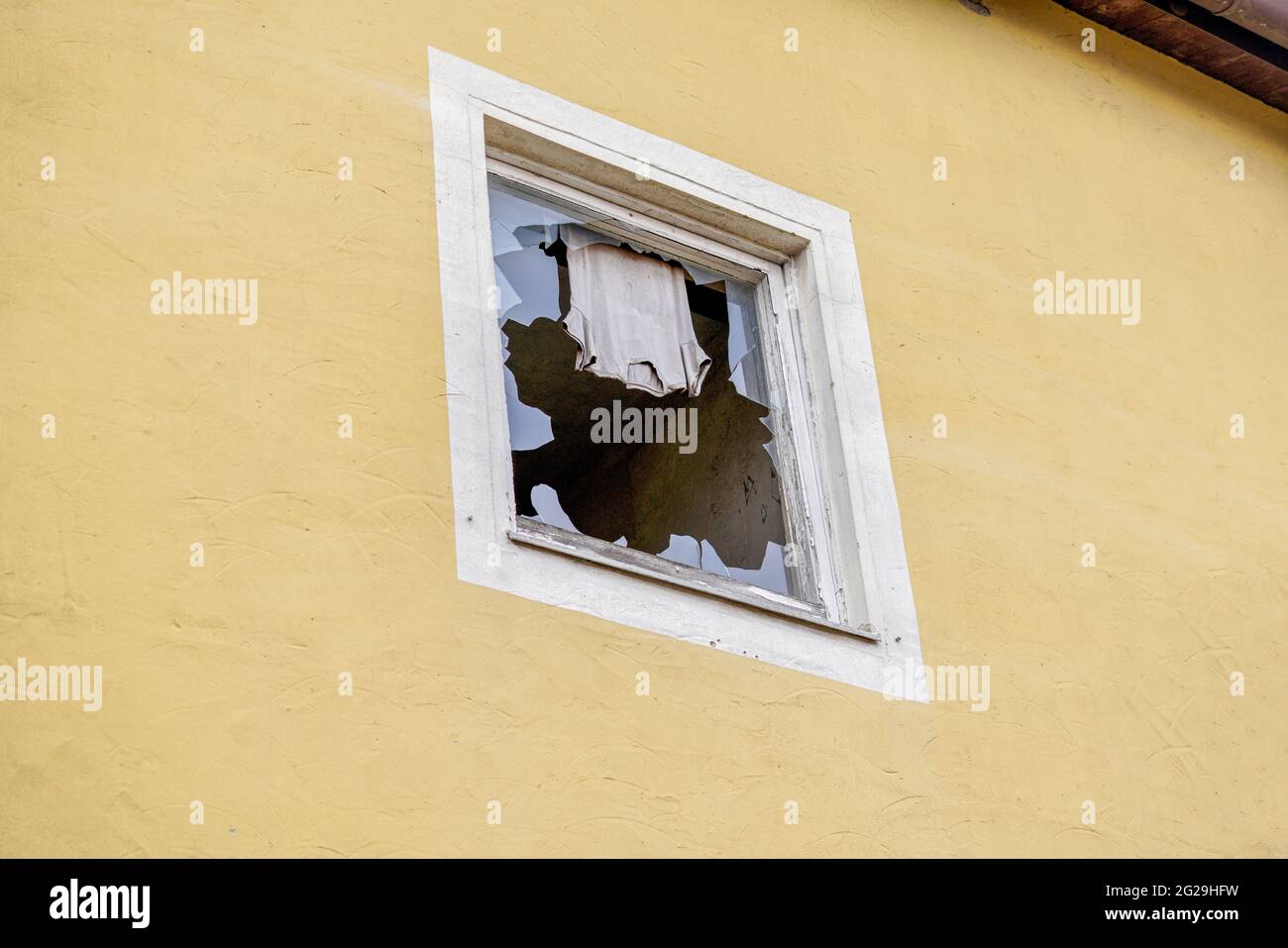 Old wooden frame and broken glass window on an old building for ...
