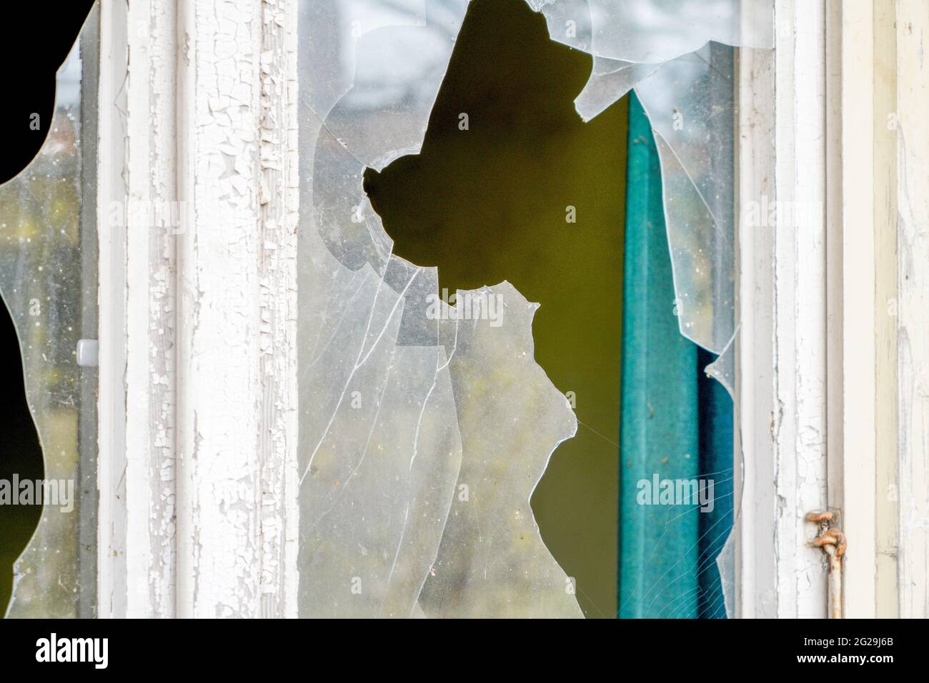 Old wooden frame and broken glass window on an old building for ...