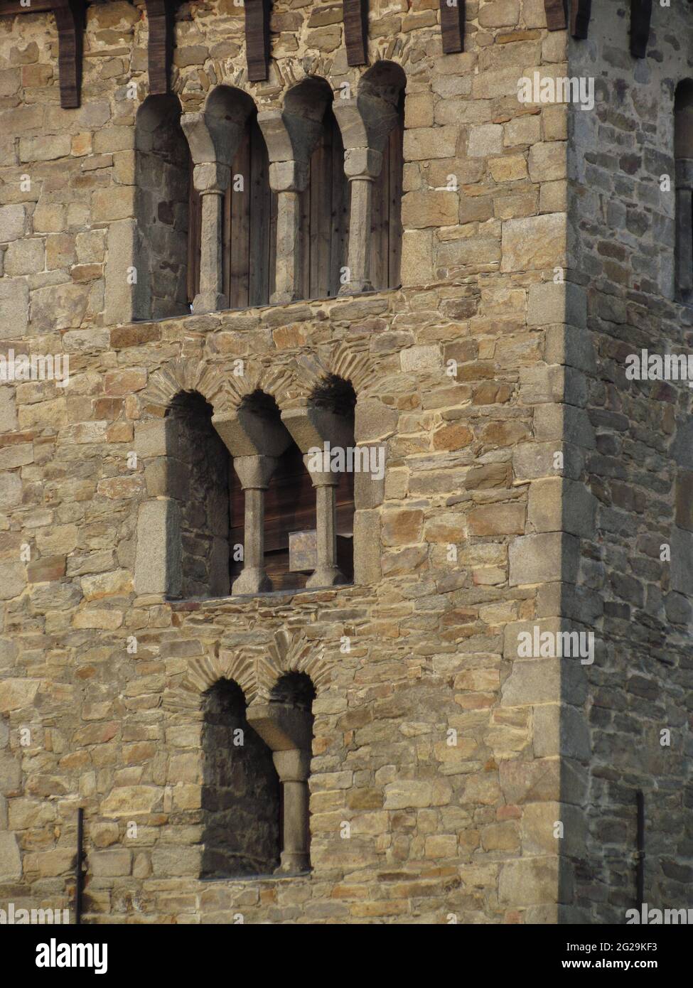 Detail of Romanesque stone masonry with typical arched windows ...
