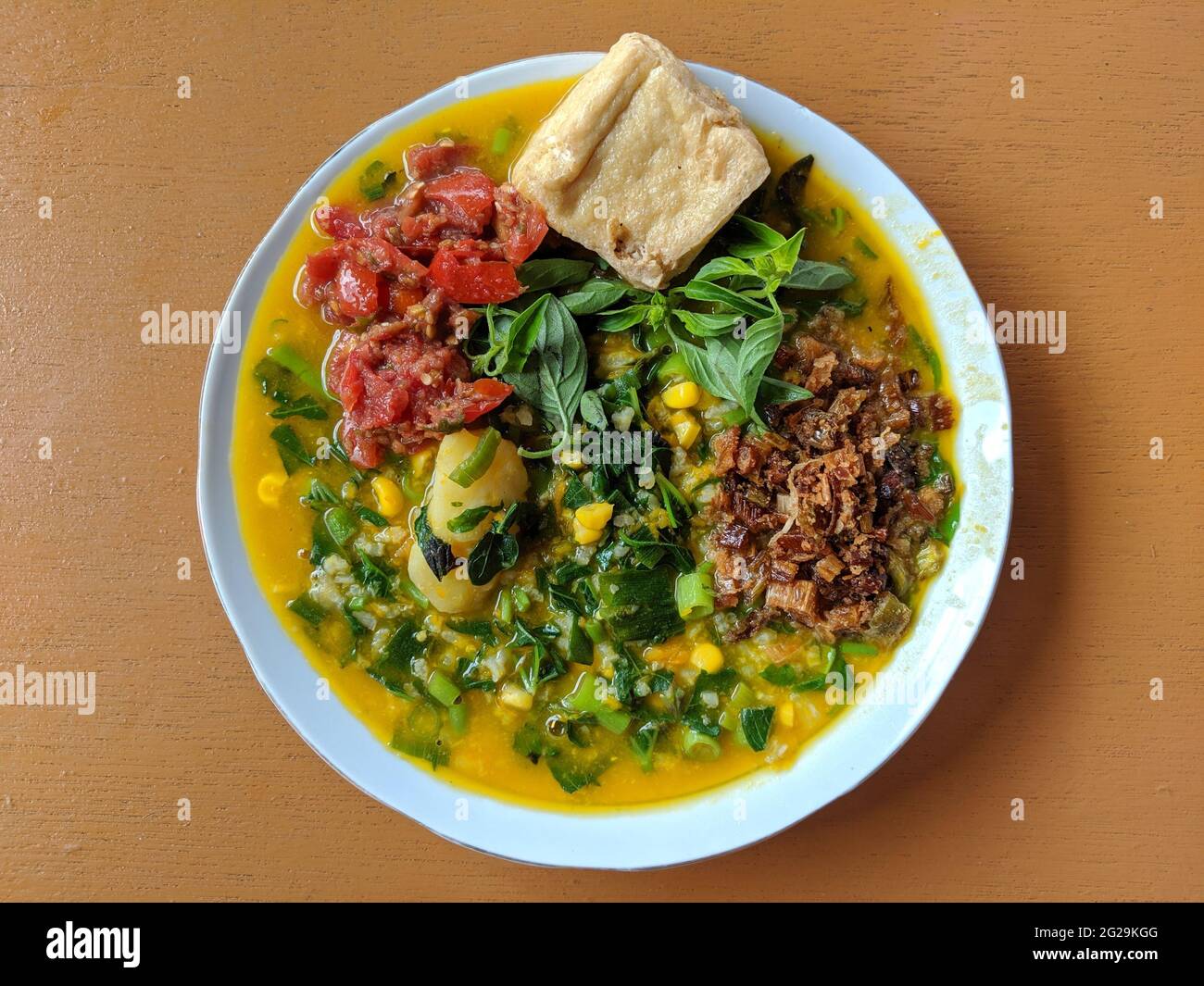 Top view of traditional Bubur Manado Tinutuan (Manadonese porridge) in ...