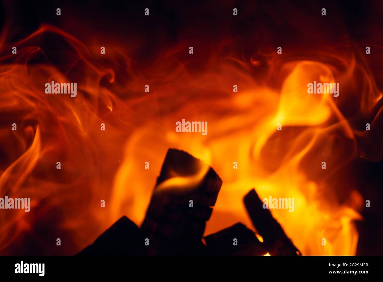 A fire burns in a fireplace, Fire to keep warm Stock Photo - Alamy