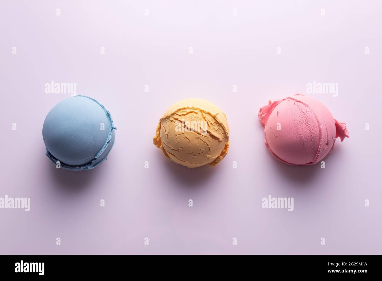 set of colored balls of ice cream on a white background Stock Photo - Alamy