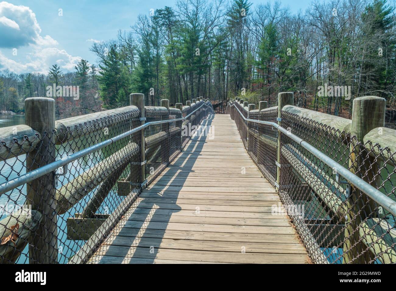 Inside perspective view of a hiking trail bridge a sturdy wooden ...