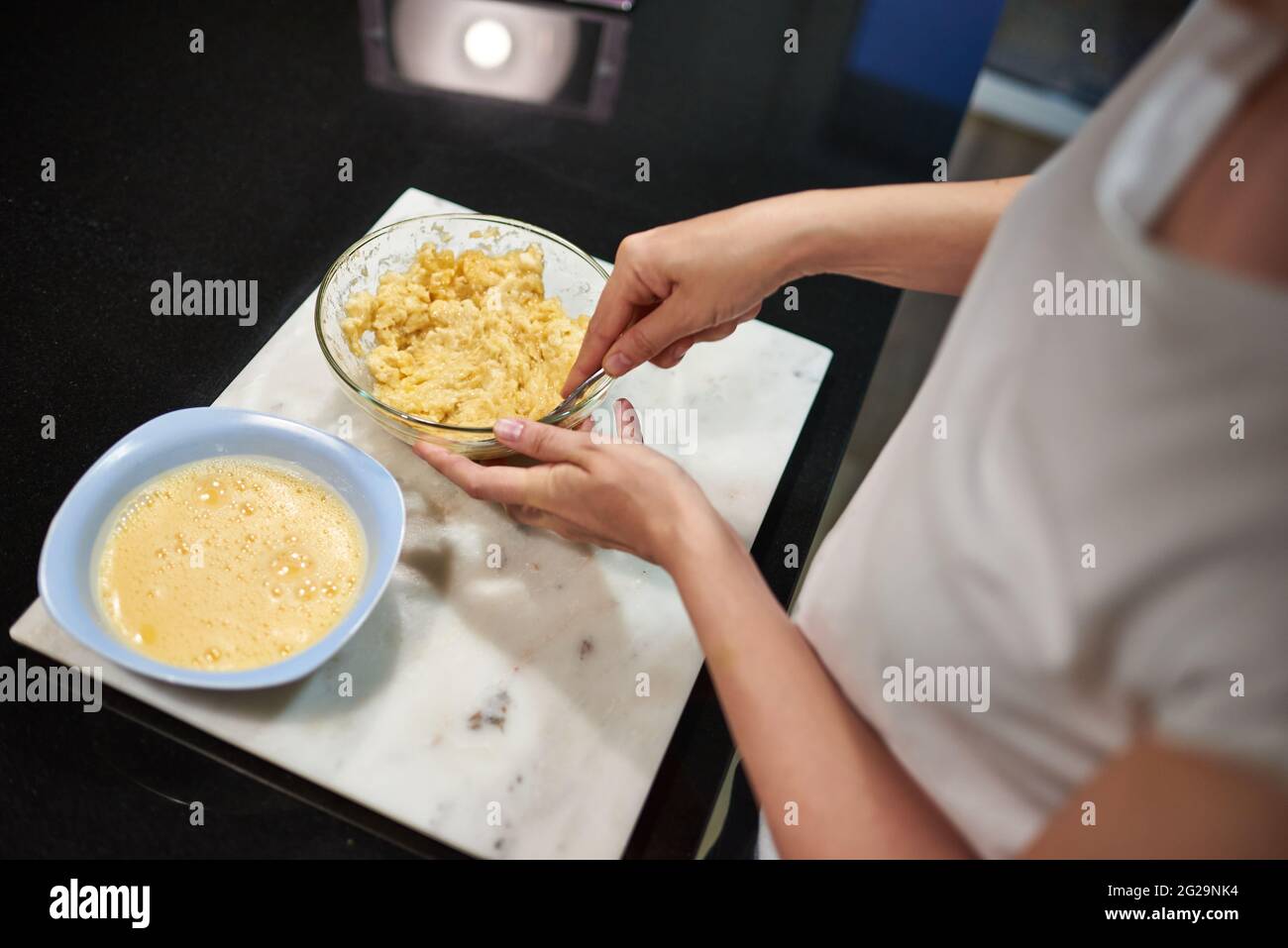 woman smash banana to make banana pancakes Stock Photo - Alamy