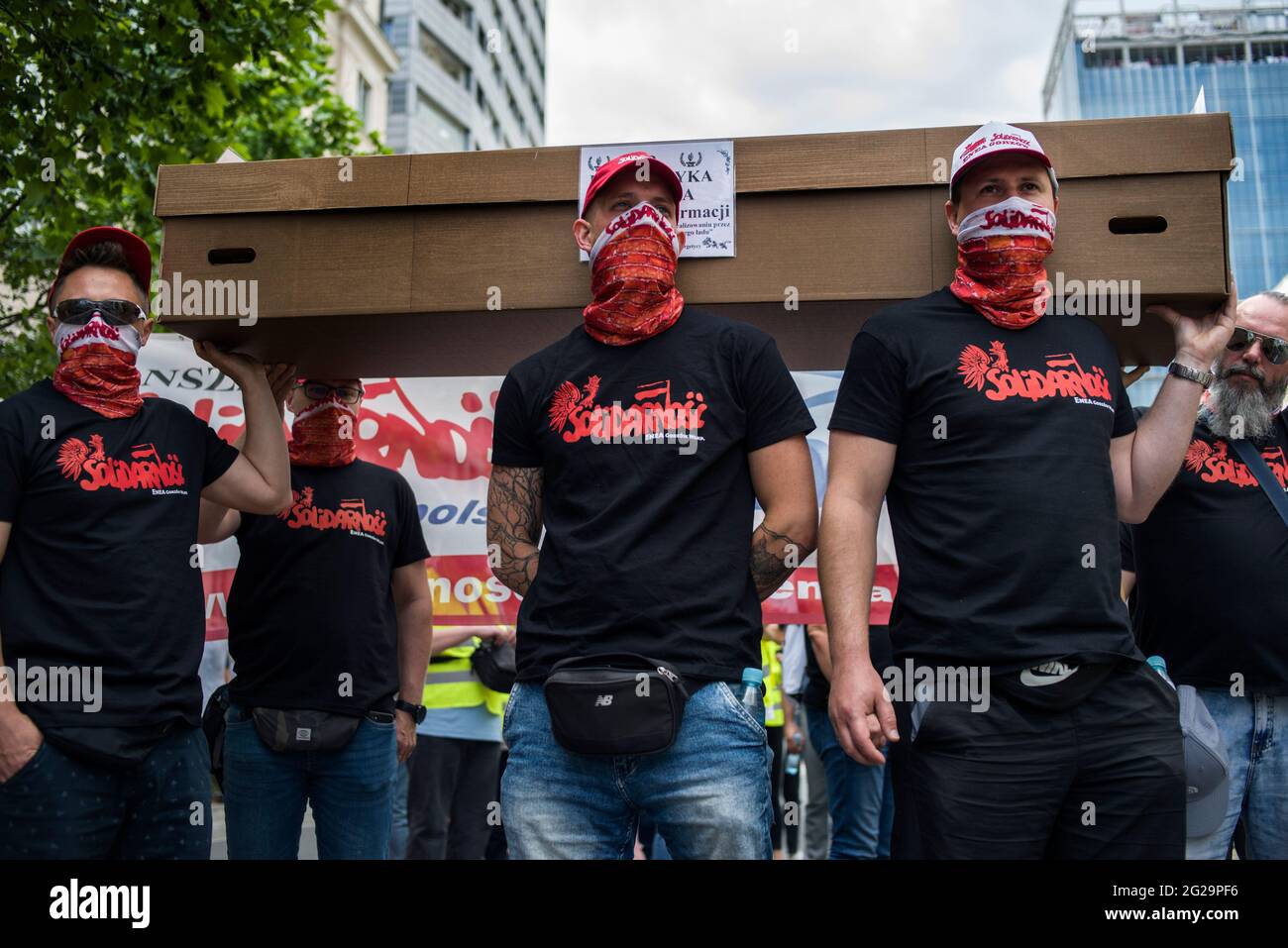 Protesters hold a self made coffin symbolizing the death of the "Polish ...