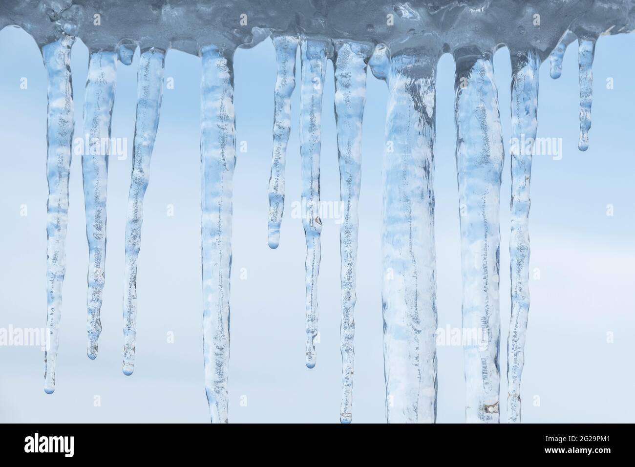 Icicle close up with detail. Ice spike hanging. Frozen water in large ...