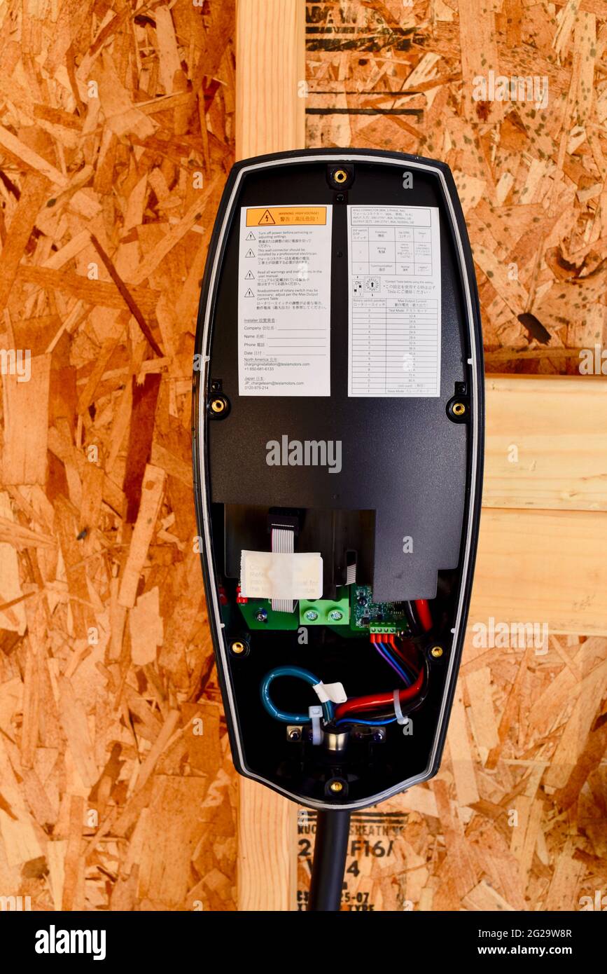 Tesla Connector Charger mounted inside garage at private residence used ...