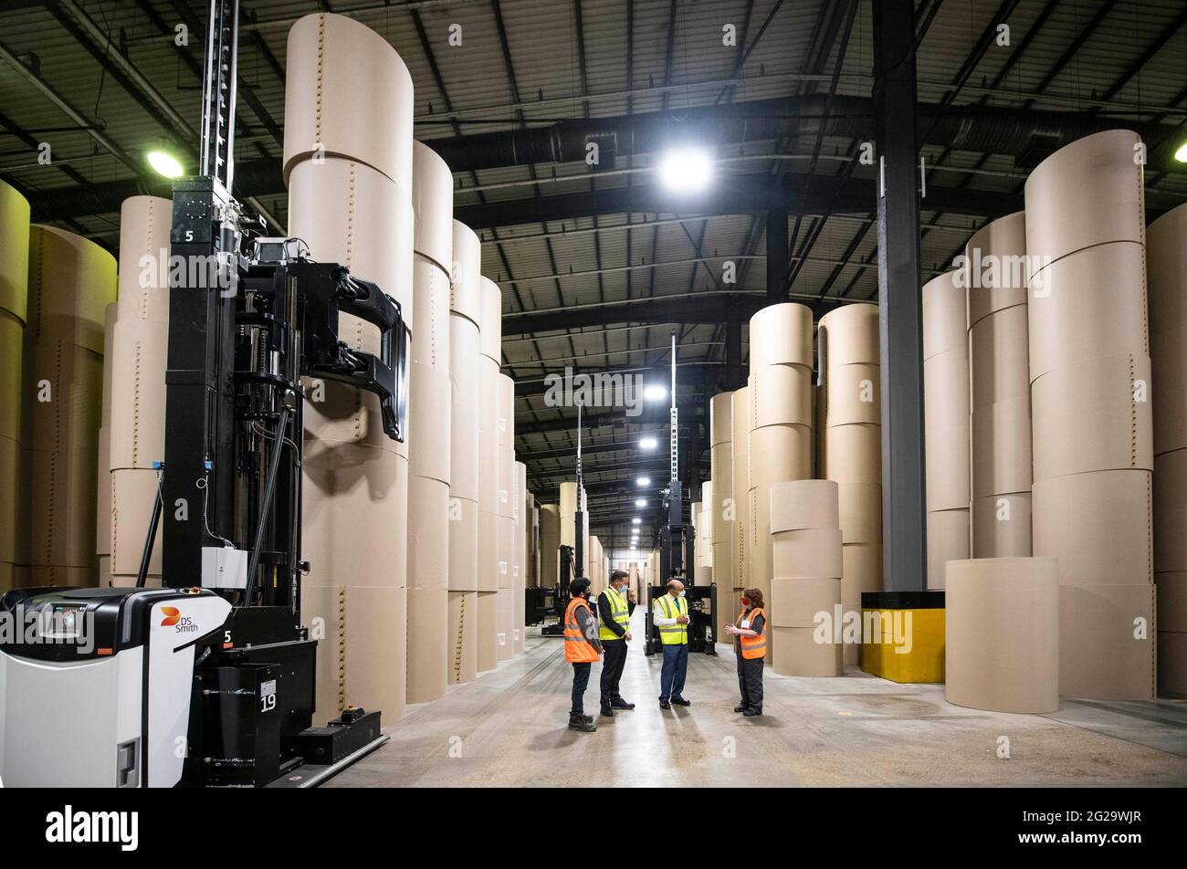 EDITORIAL USE ONLY Andrew Griffith MP, is shown around by staff at DS ...