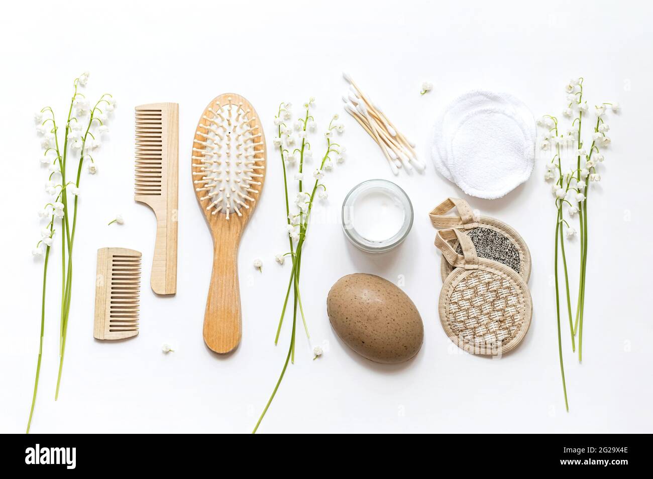 Eco cosmetic products. Glass jar of organic cream, reusable cotton pads ...