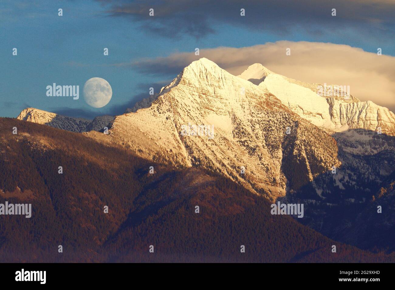 Full moon over snow capped hi-res stock photography and images - Alamy