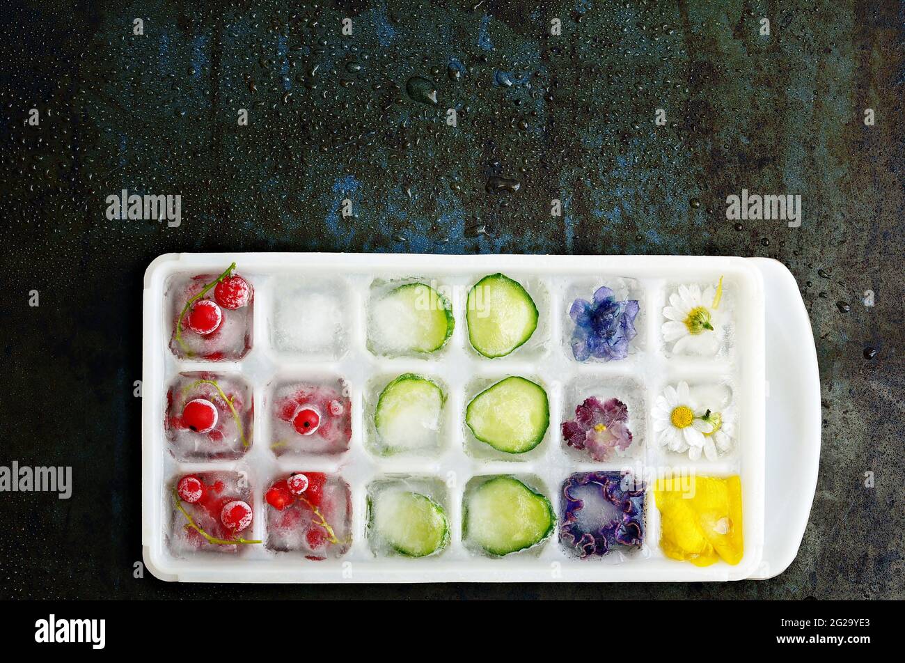 Frozen vegetables and berries in ice cubes hi-res stock photography and ...