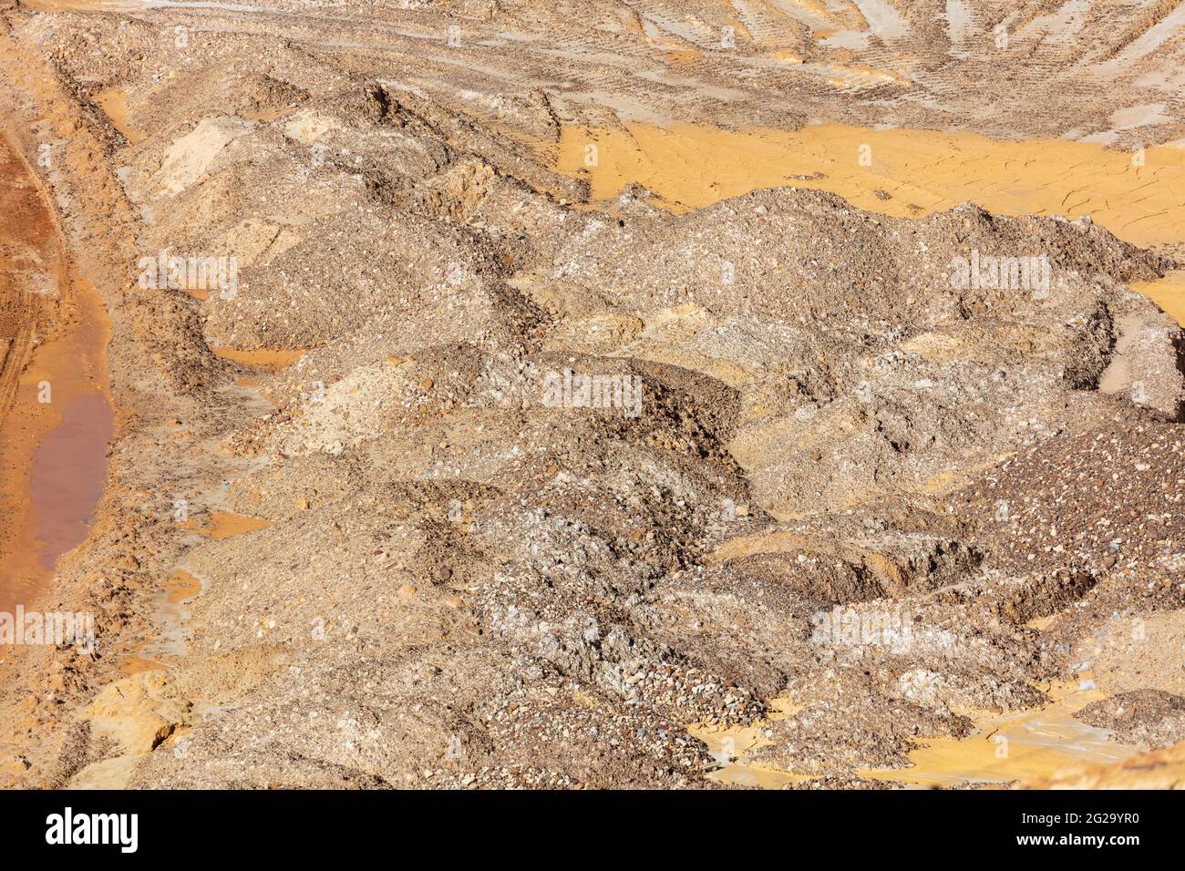 Photograph of crushed sand and stone laying on the ground in a large ...