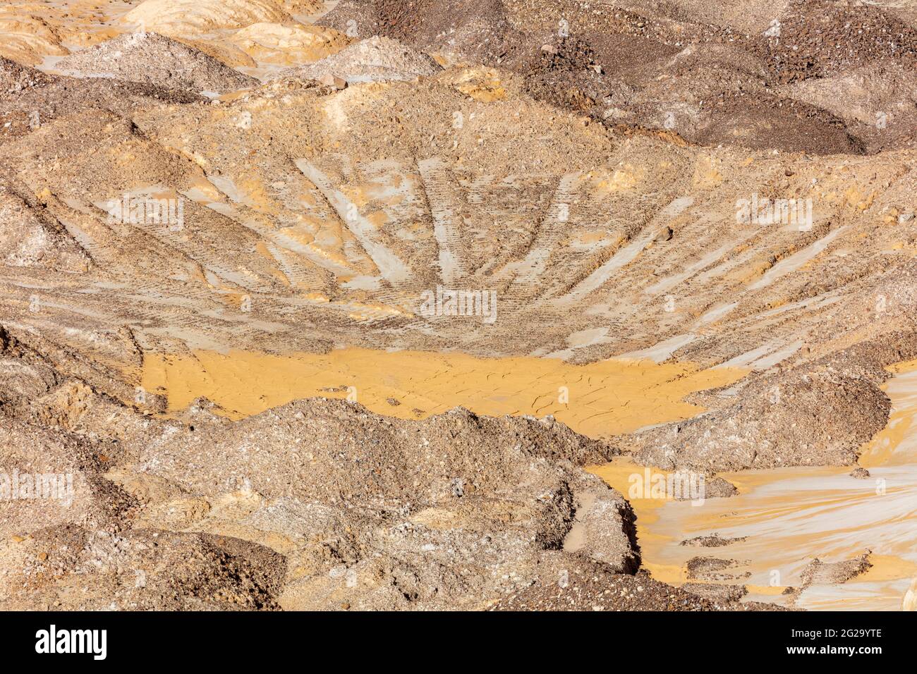 Photograph of crushed sand and stone laying on the ground in a large ...