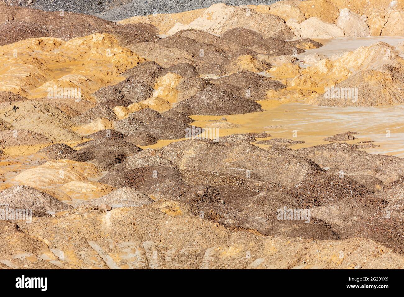 Photograph of crushed sand and stone laying on the ground in a large ...