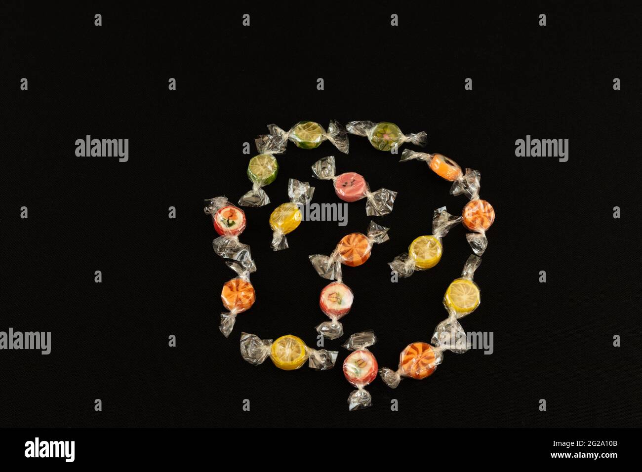 Closeup shot of candies isolated on a black background Stock Photo - Alamy