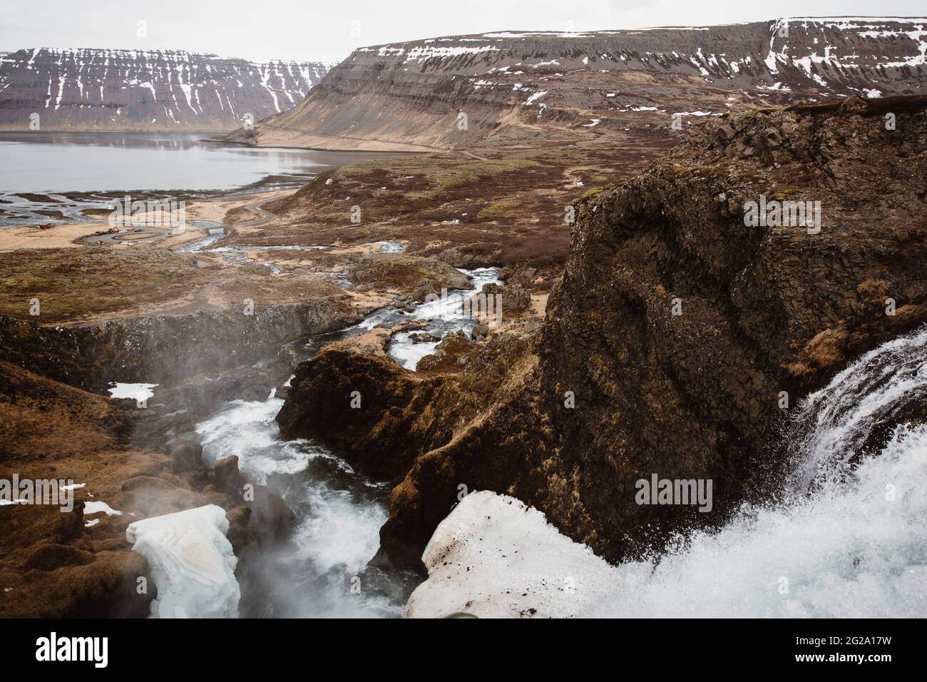 Flow of water on cold rocks Stock Photo - Alamy