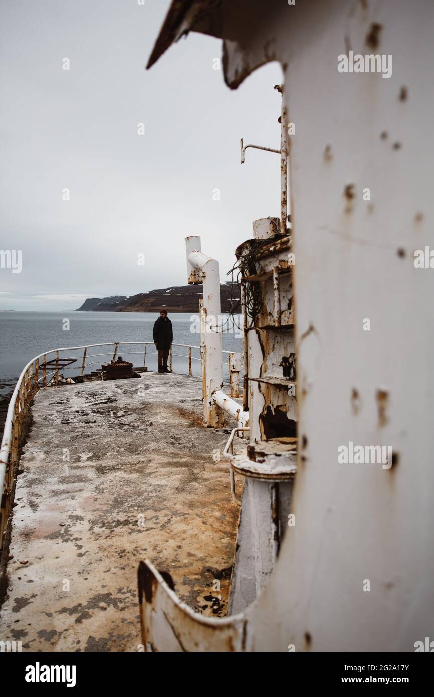 man standing on ship deck Stock Photo - Alamy