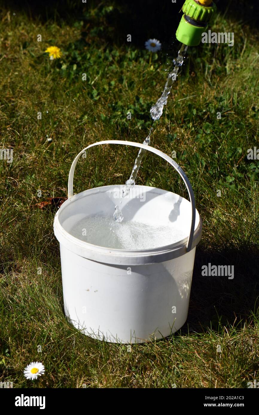 Vertical shot of a bucket of water Stock Photo - Alamy