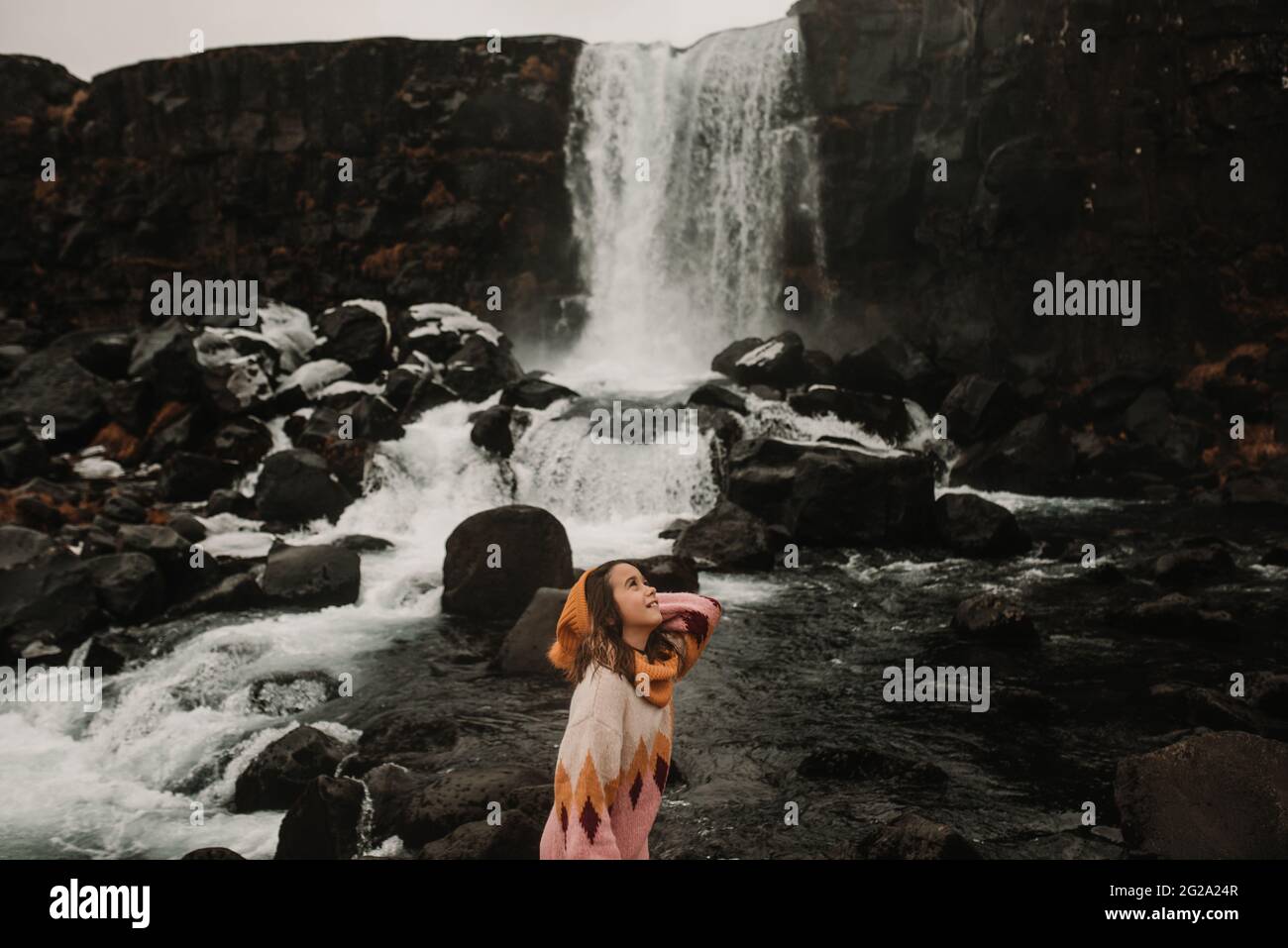 Woman next to waterfall hi-res stock photography and images - Alamy