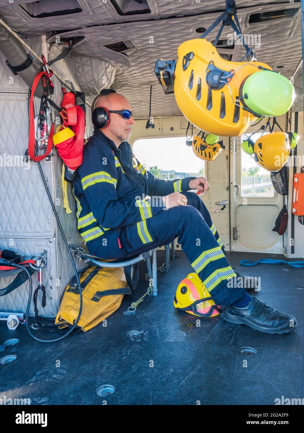 Fireman sitting concentrated ready to fly for help Stock Photo - Alamy