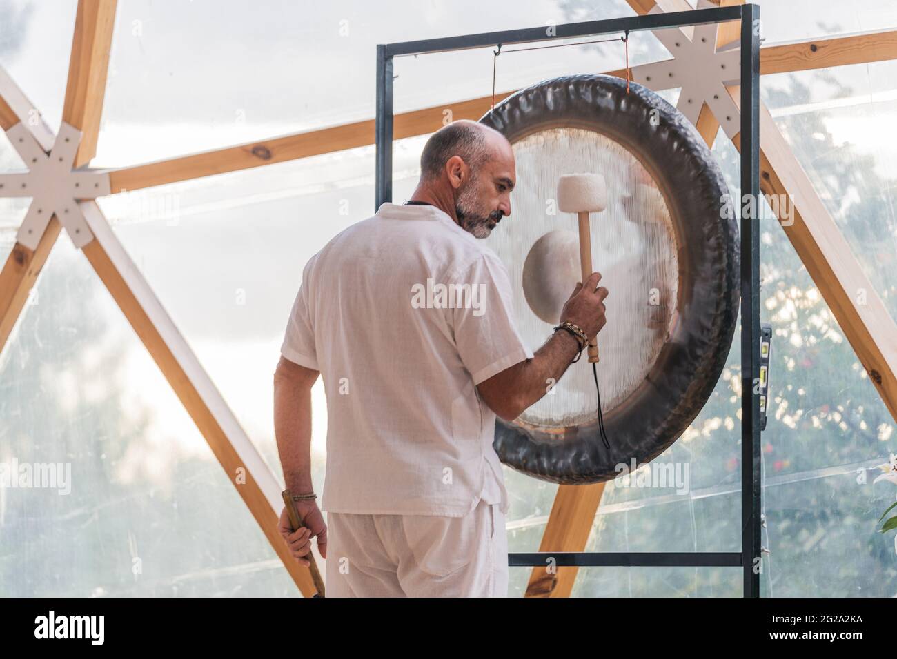 Man hitting gong hi-res stock photography and images - Alamy
