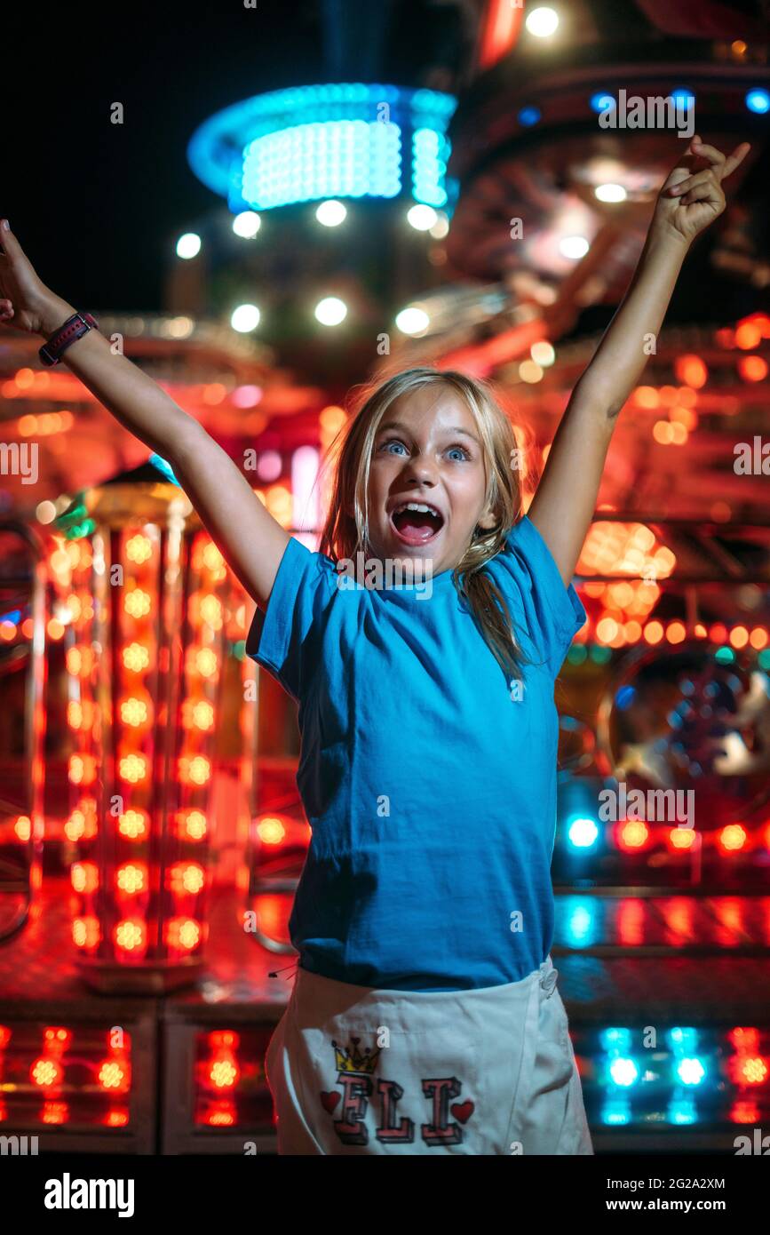 Little girl having exciting experience in the roller coaster. Motion ...