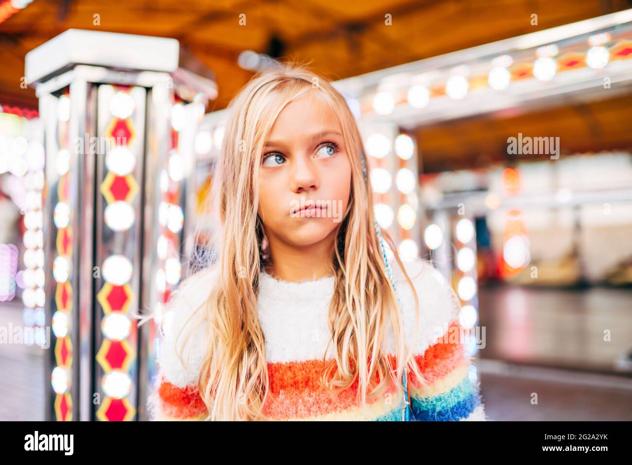 Little girl has fun at the fair with lights Stock Photo - Alamy