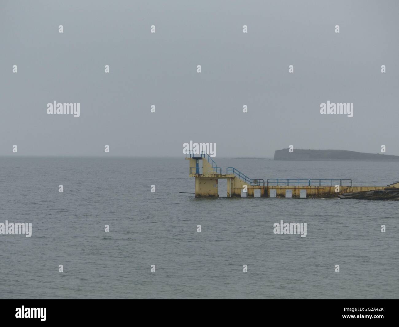 Dock in the cloudy dark evening Stock Photo - Alamy