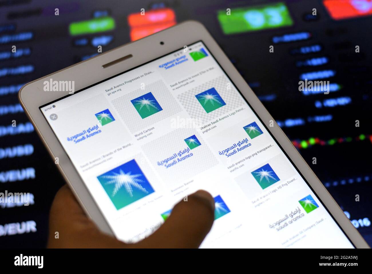 In this photo illustration, Saudi Aramco logos seen displayed on an ...