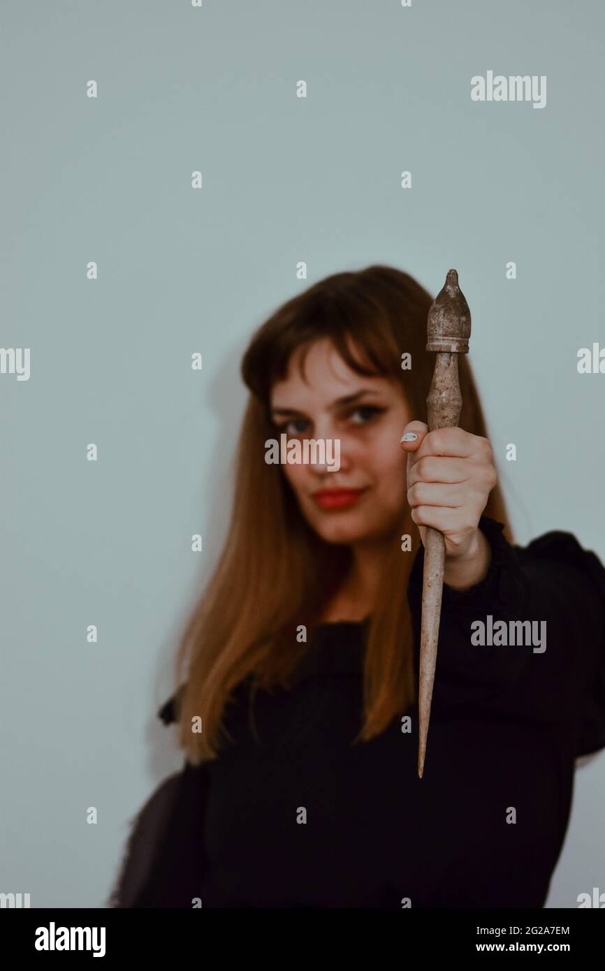 Young woman holding magic wand hi-res stock photography and images - Alamy