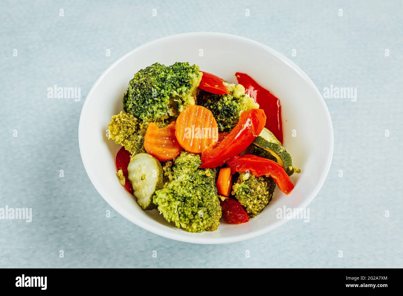 Closeup shot of a healthy vegetable salad in a white bowl on a ...