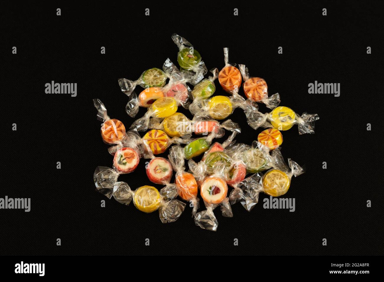 Closeup shot of candies isolated on a black background Stock Photo - Alamy