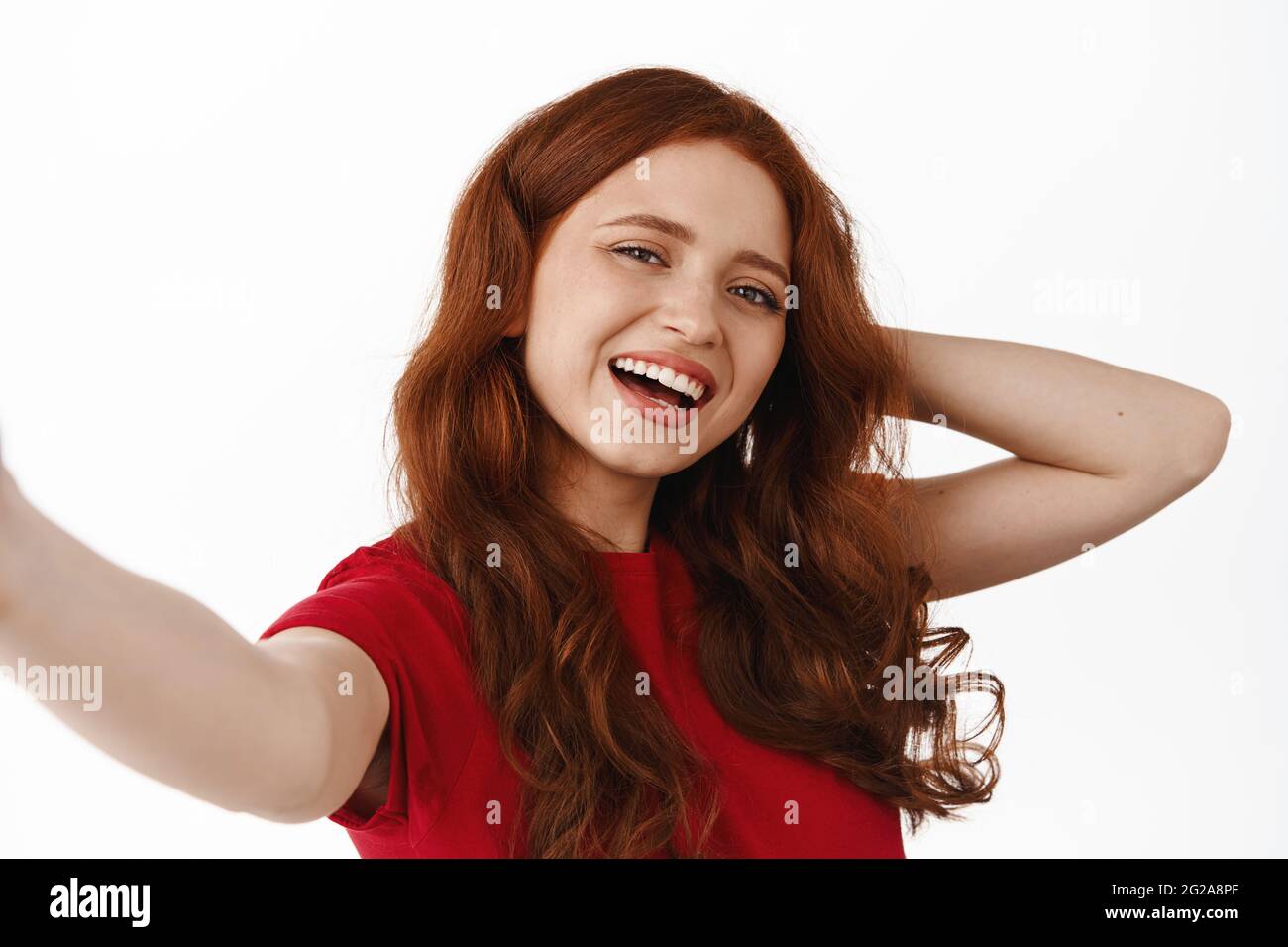 Close Up Portrait Of Ginger Girl Taking Selfie On Smartphone Posing At