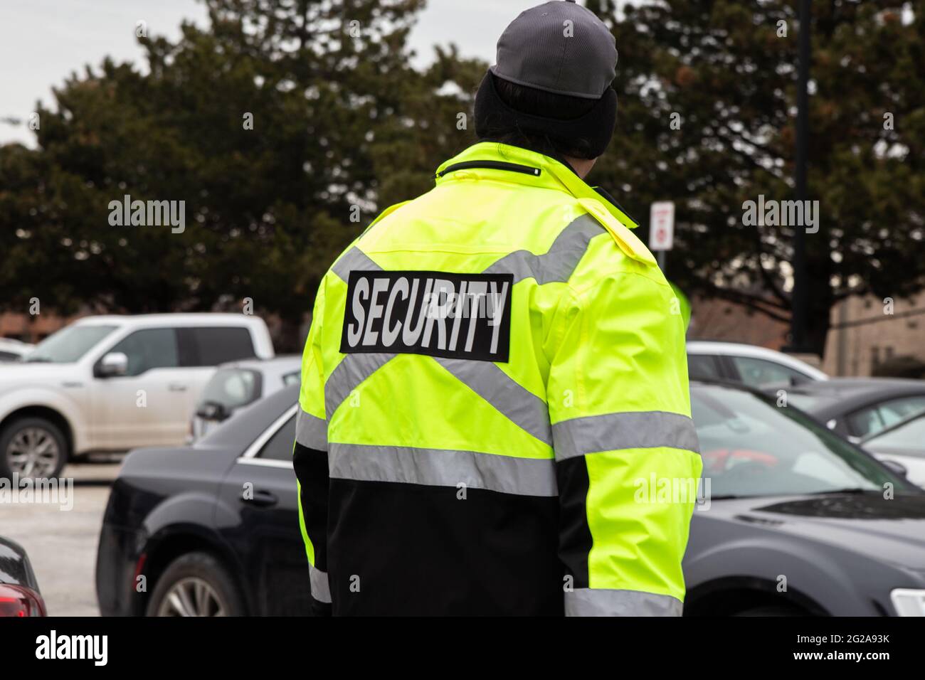 Rear view of parking security watching over the parking area Stock ...