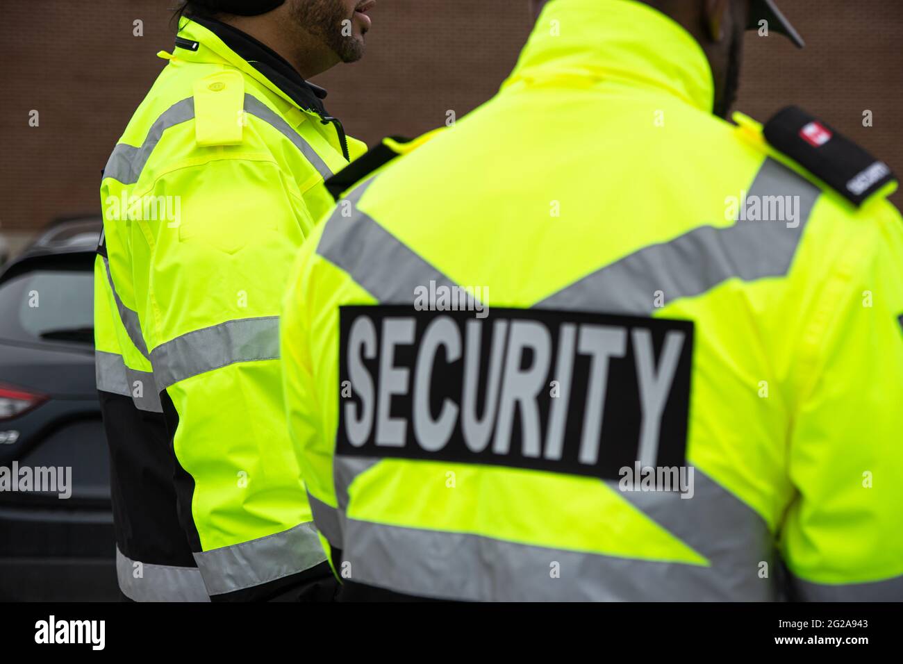 Rear view of parking security watching over the parking area Stock ...