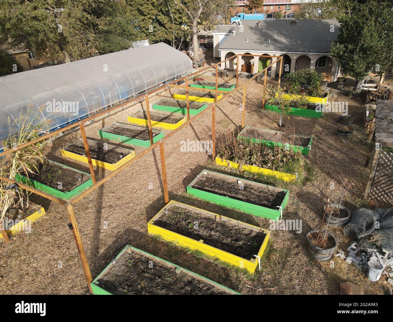 Small farm with colorful greenhouses Stock Photo - Alamy