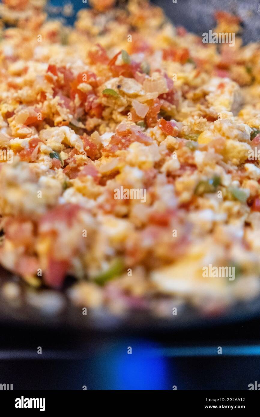 Delicious Mexican-style scrambled eggs in a frying pan Stock Photo - Alamy