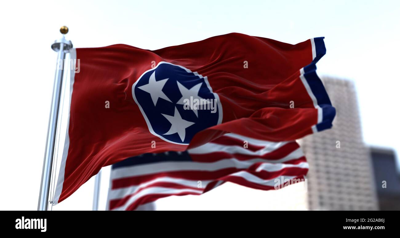 The flags of the Tennessee state and United States of America waving in ...