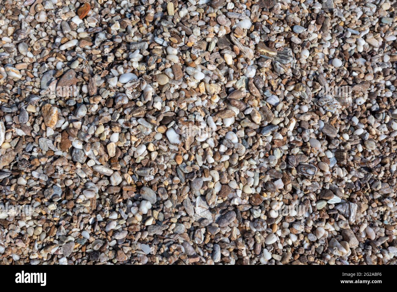 Aegean sea pebble marble stone beach close-up texture. Various rocky ...
