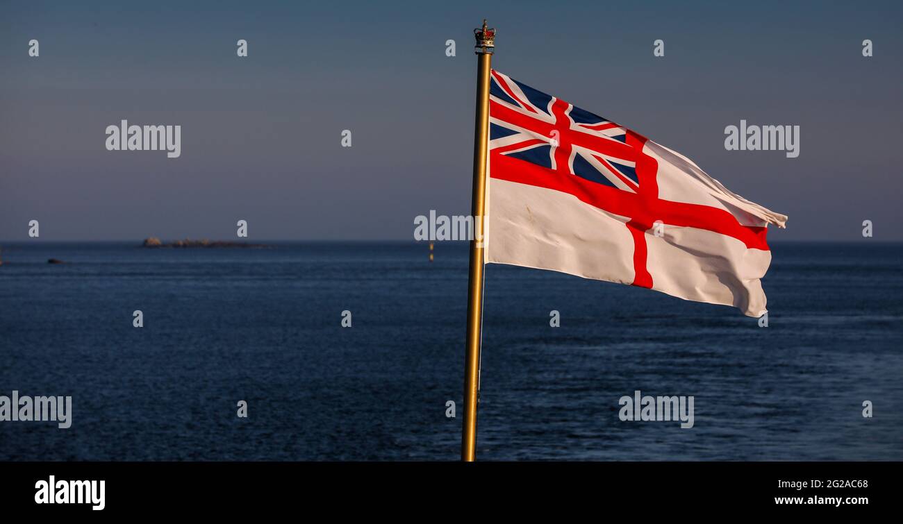 The flag of the British Royal Navy the White Ensign being flown from ...