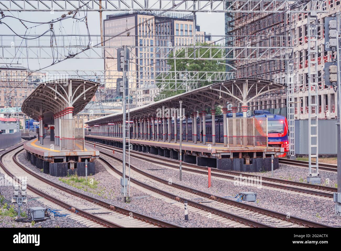Electric train stands by the platform at sunset time. Moscow. Russia ...