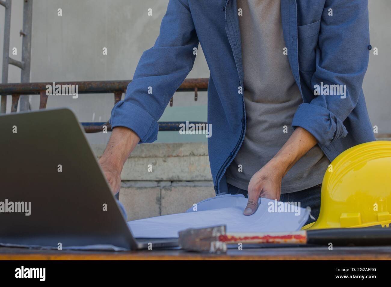 Worker employee working by computer technology on site construction ...