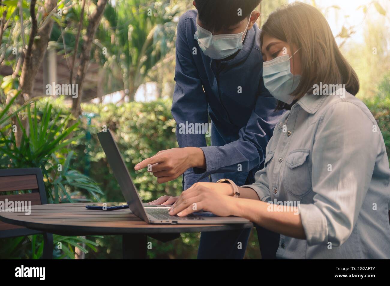 Two people working job freelance on computer notebook at cafe Stock ...