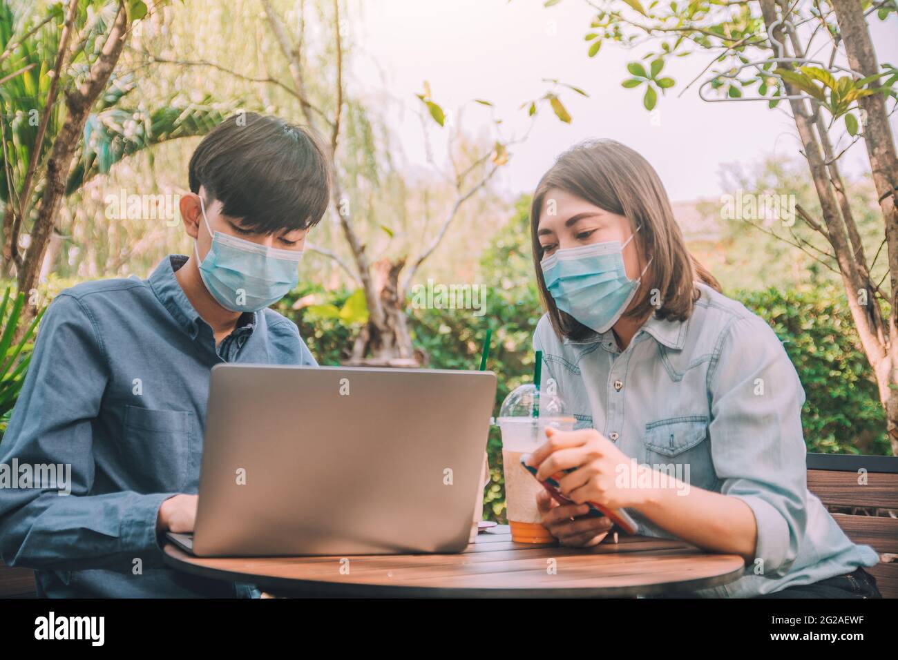 Businessman wear mask using laptop hi-res stock photography and images ...